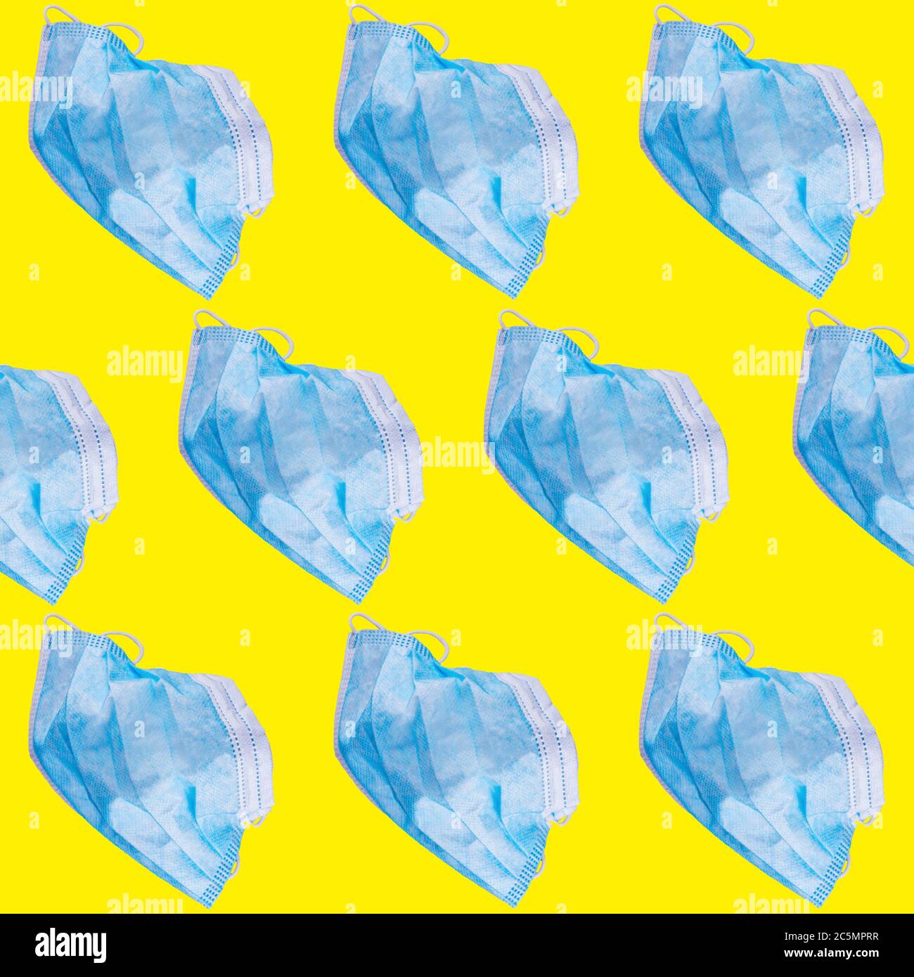 Creative pattern with surgical masks. Face protective masks on a yellow ...