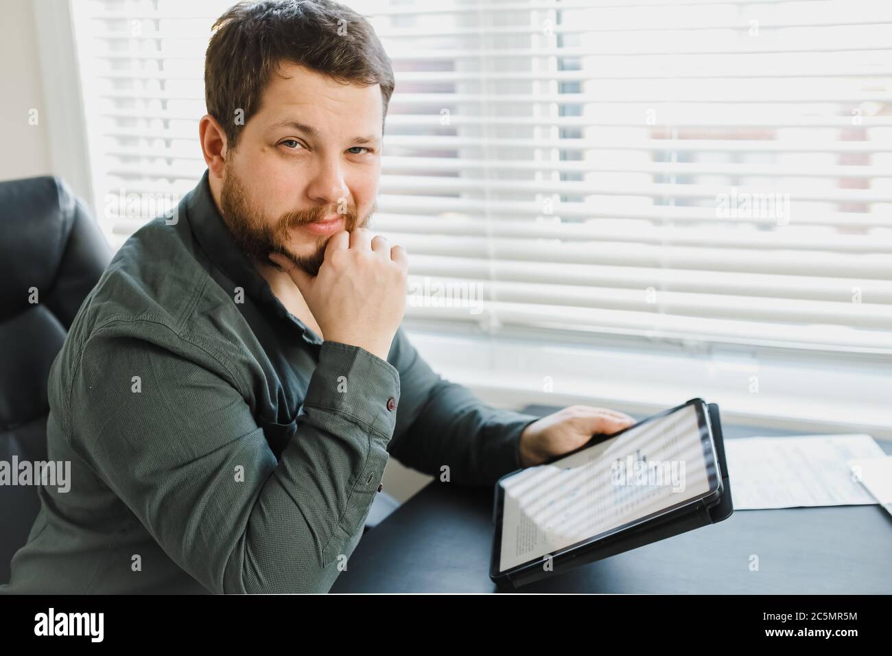 Man looking at business graphs hi-res stock photography and images - Alamy