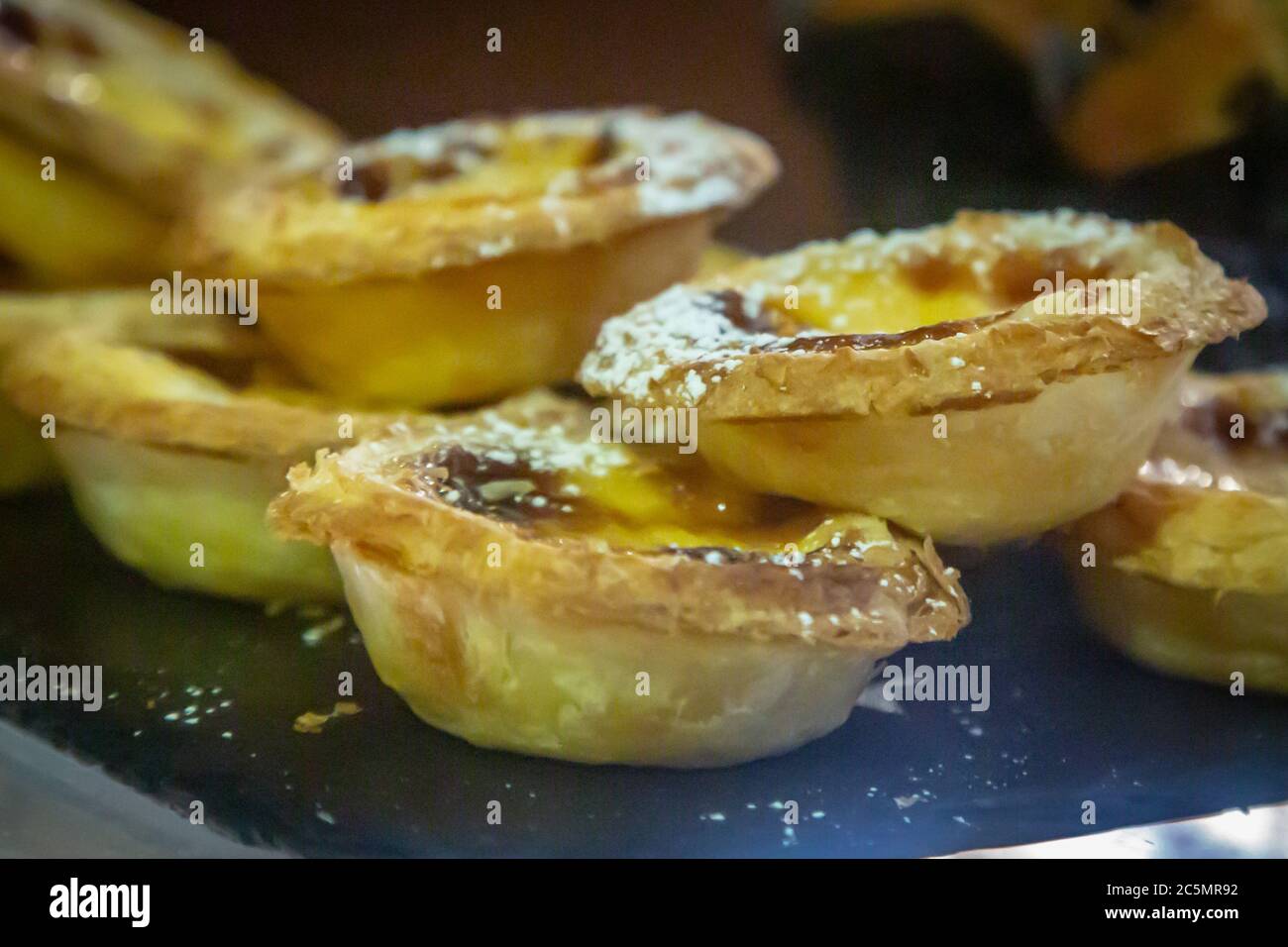 Portuguese custard tarts on a coffee shop counter Stock Photo - Alamy