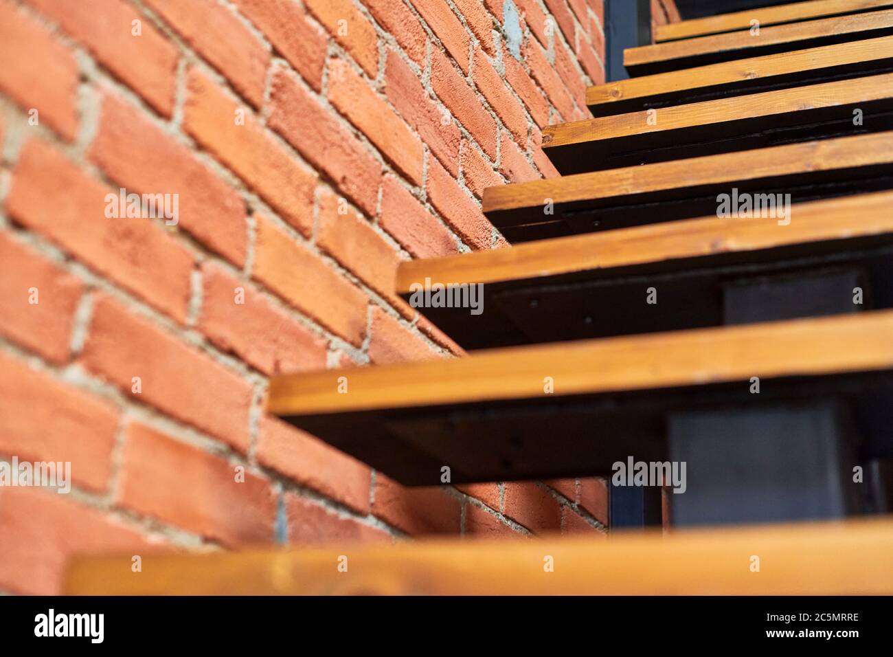 Stairs in loft apartment. Staircase without railing. Modern hipster ...