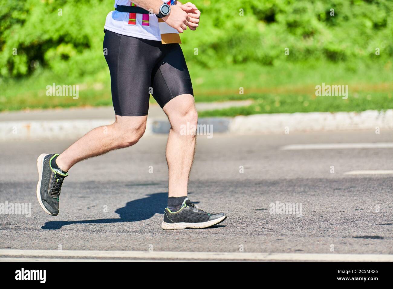 Running man. Athletic man jogging in sportswear on city road. Healthy ...