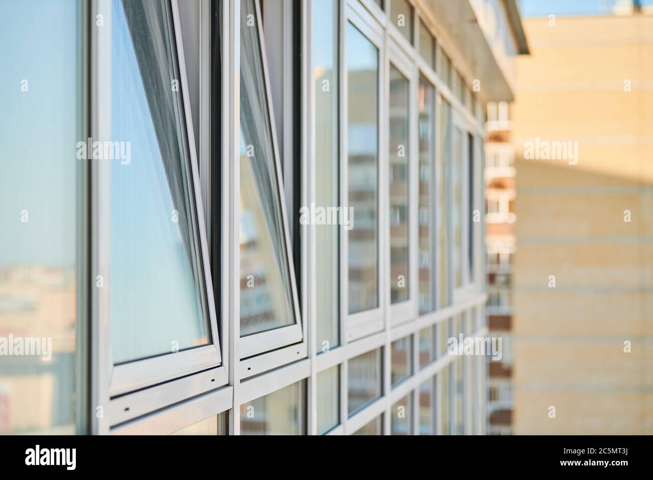 PVC windows on facade of skyscraper. Plastic double glazed windows ...
