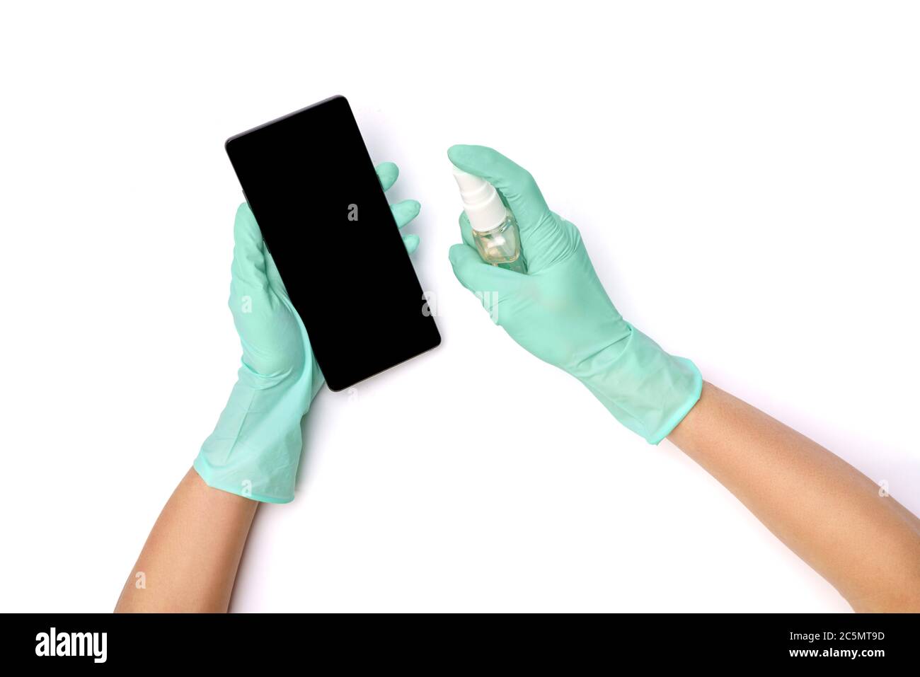 Female's hands wiping mobile phone with alcohol sanitizing agent, top ...