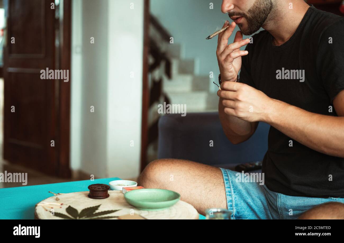 Young person smooking marijuana joint - Cannabis, stoner and weed ...