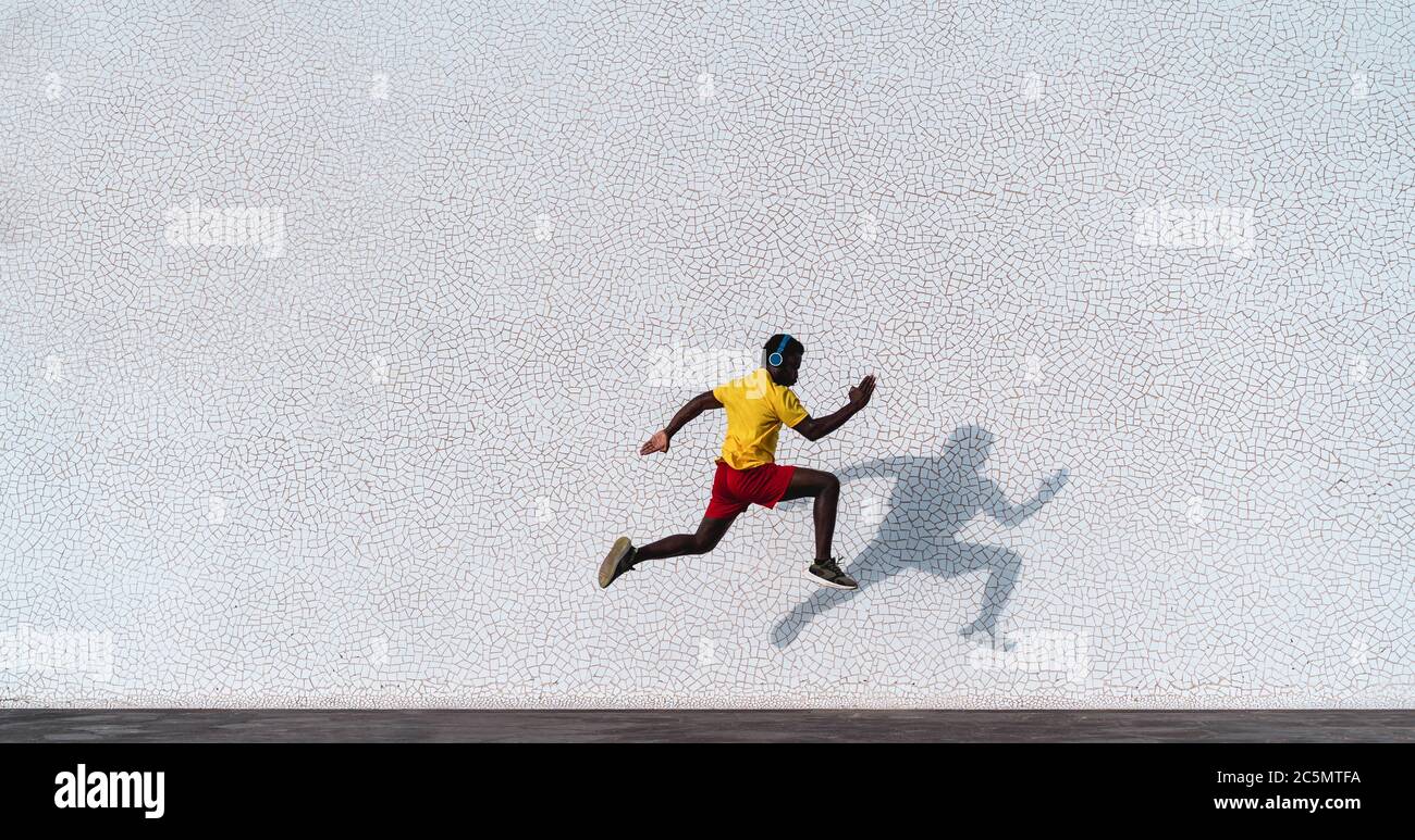 Young black man doing workout routine at morning time while running ...