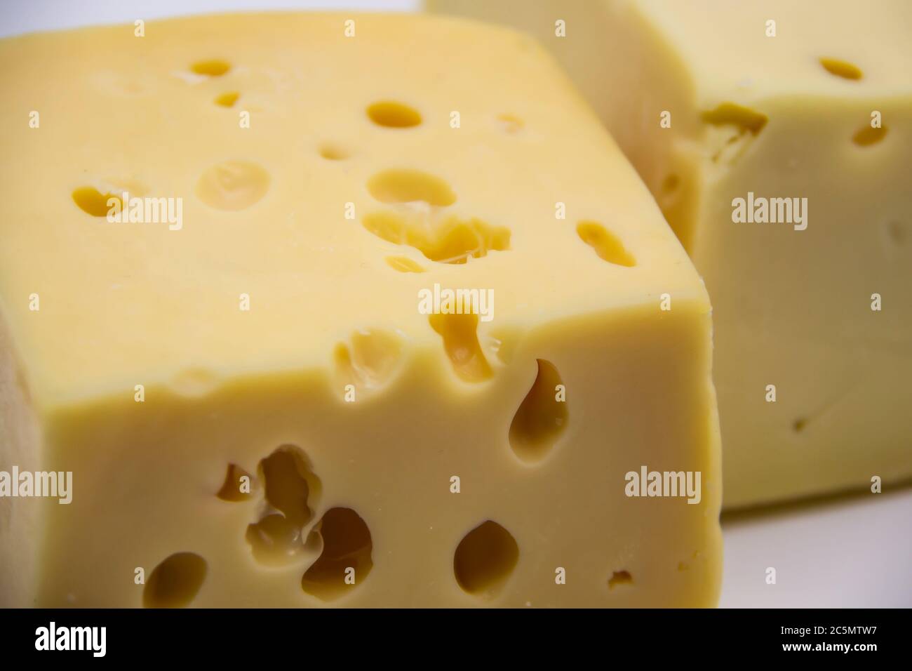 Hard cheese holes on cutting hi-res stock photography and images - Alamy