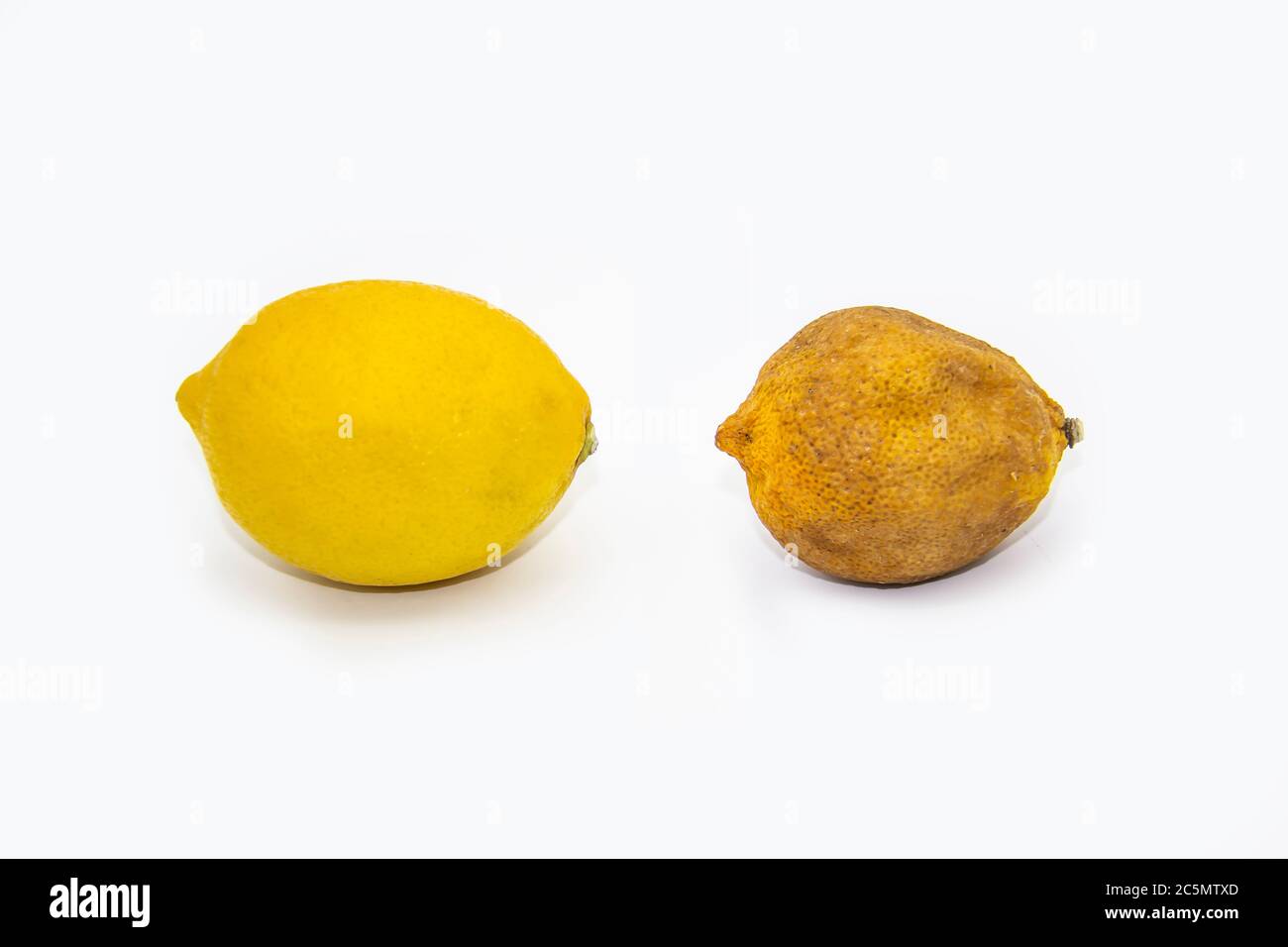 Fresh lemon with spoiled and dry lemon isolated on white background ...
