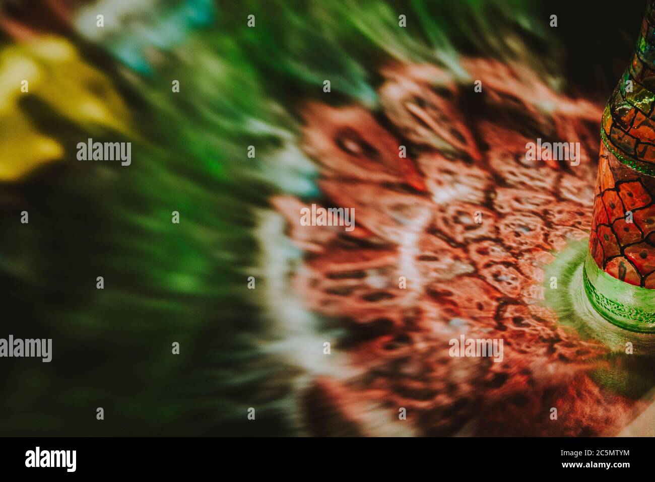 light passing through an bottle with colored art Stock Photo - Alamy