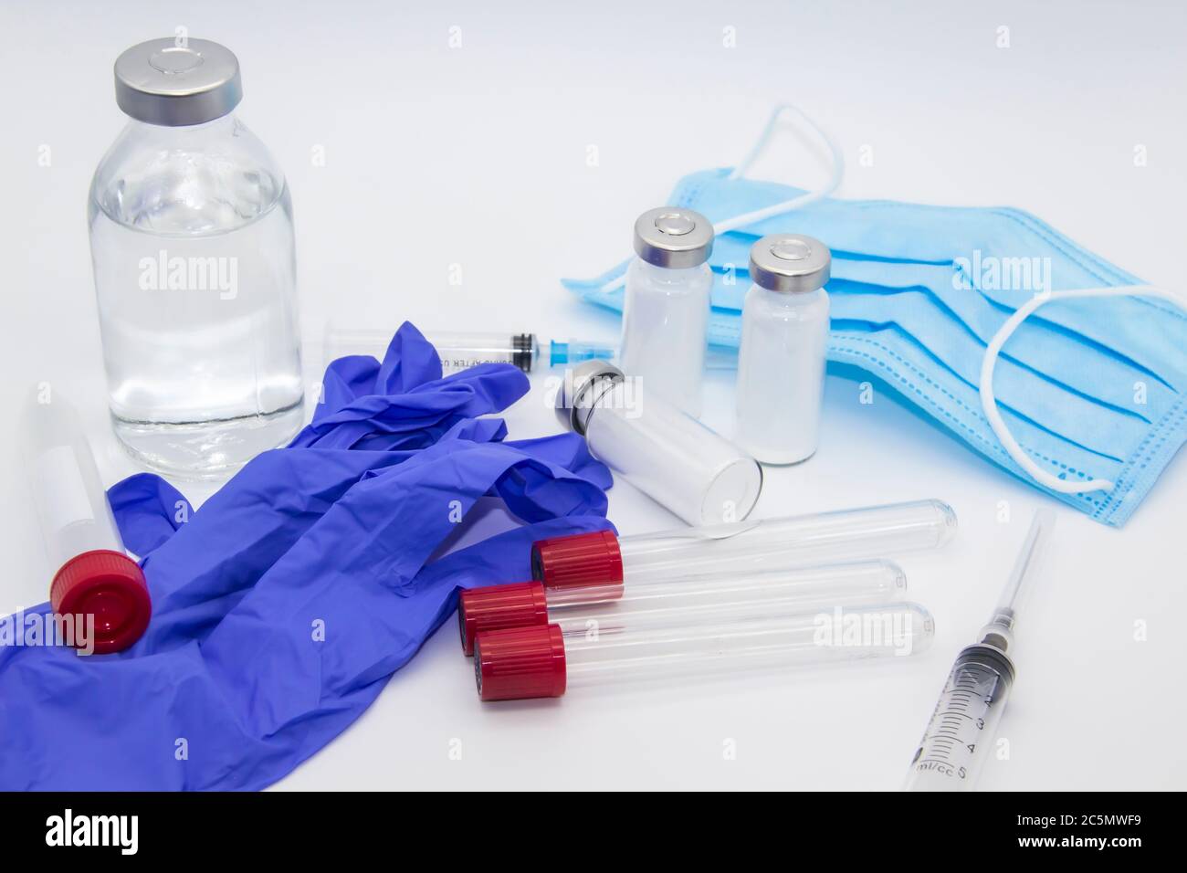 On the table are medical items and injection syringe,empty test tubes ...