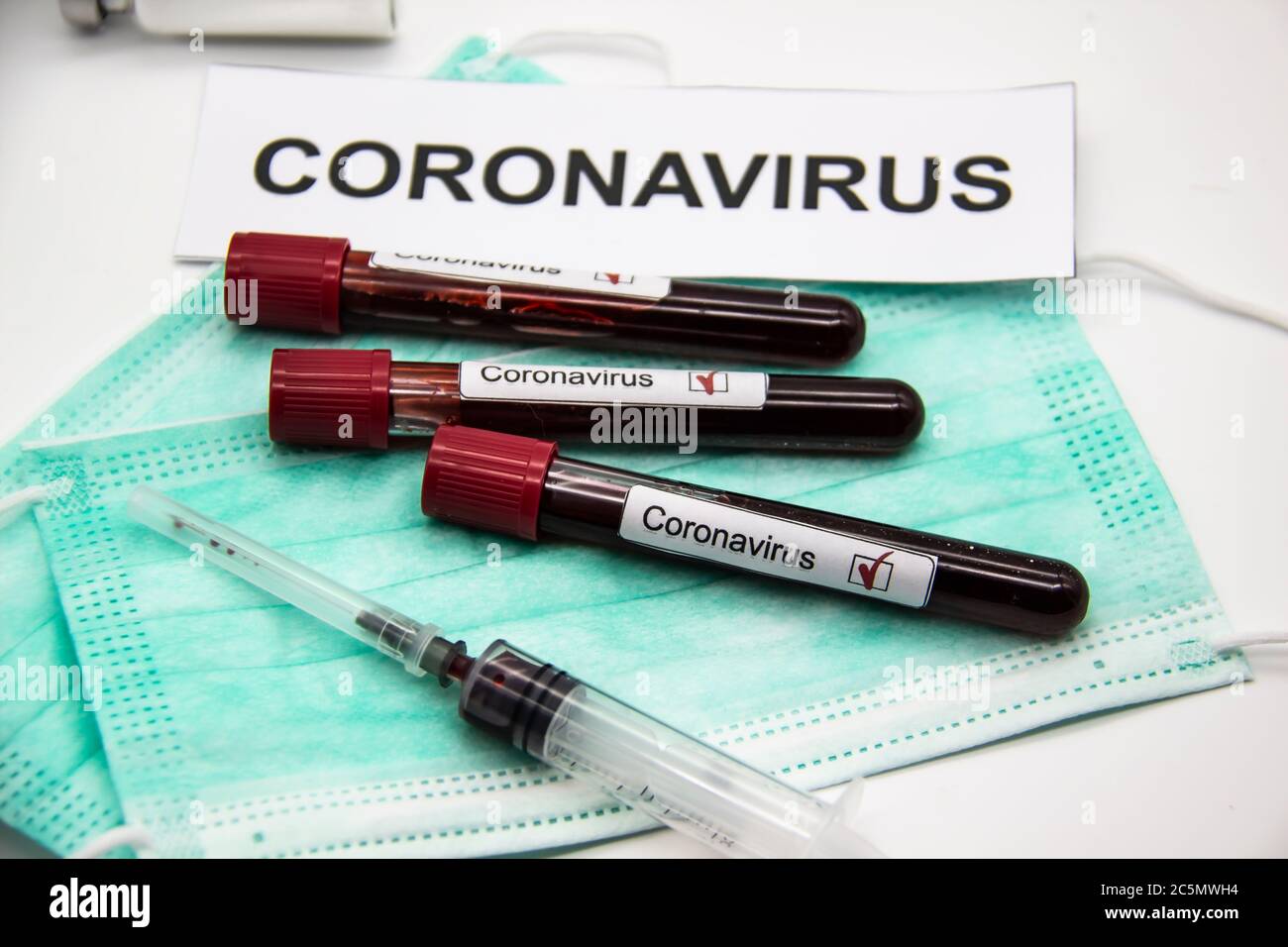 Medical masks and syringe with blood on a white background. Medical ...