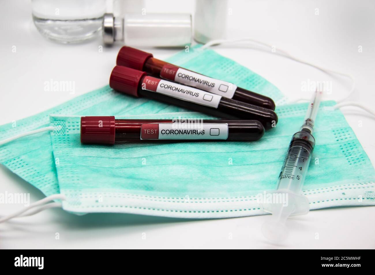 Medical masks and syringe with blood on a white background. Medical ...