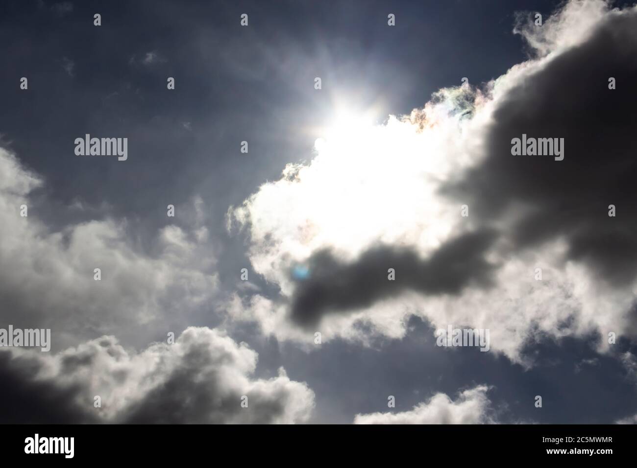 Beautiful miracle with clouds in the dark blue sky. Sun light. God ...