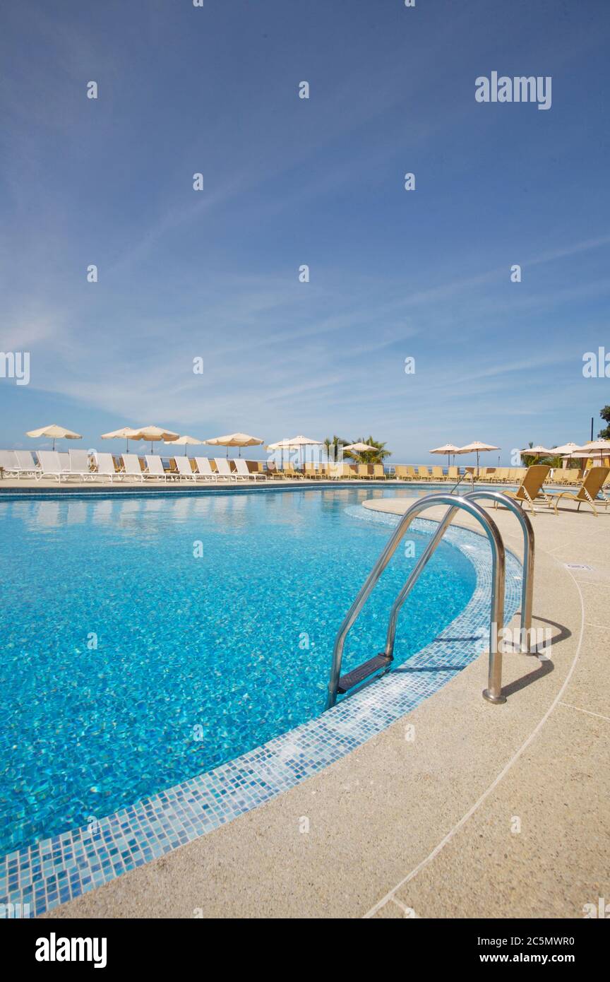 Beautiful blue sky and swimming pool with its staircase Stock Photo - Alamy