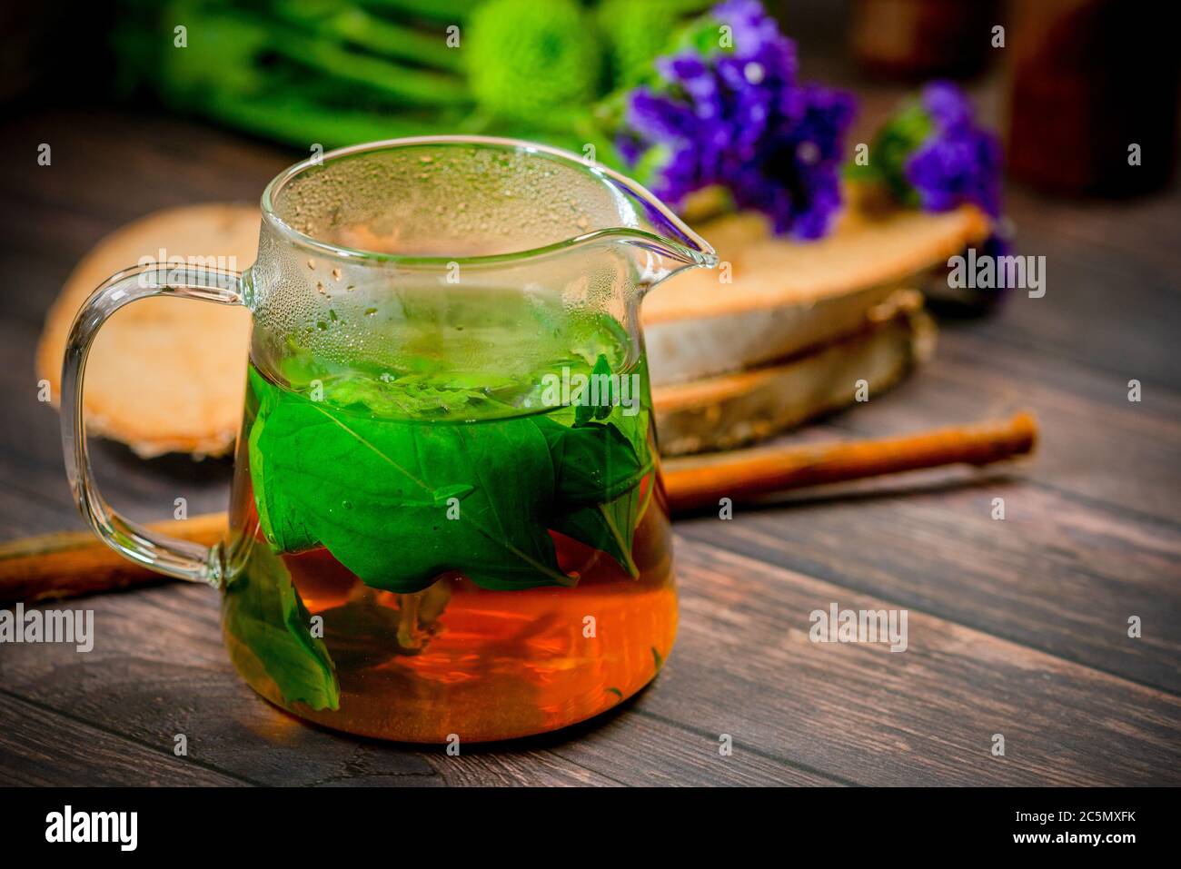 Fresh herbal tea in a glass pot Stock Photo - Alamy