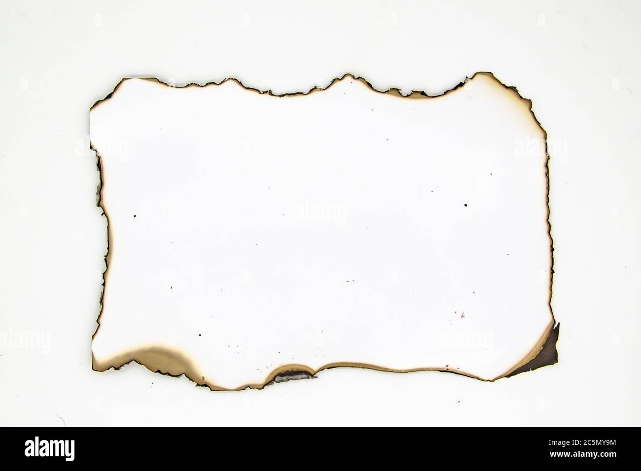 Burned photo paper on white background. Paper element can be used in ...