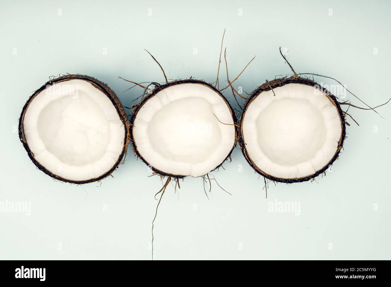 Parts of coconut on a colored background. Close up. Fresh ripe coconut ...