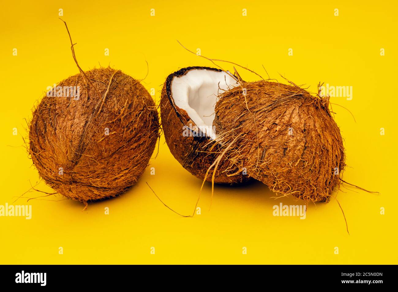 Parts of coconut on a colored background. Close up. Fresh ripe coconut ...