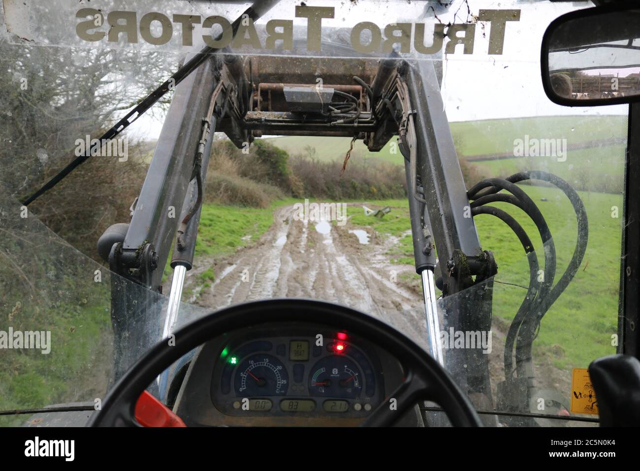 View from a Tractor Cockpit down a muddy farm track, Cornish Farm ...