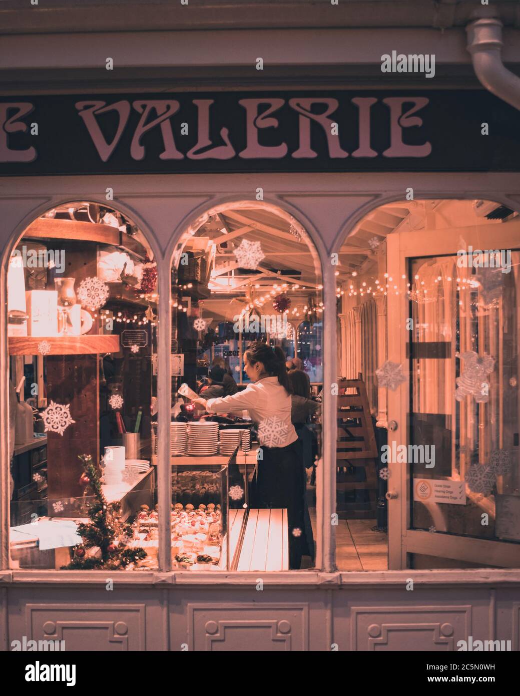 A waitress preparing food inside a patisserie Valerie restaurant Stock ...