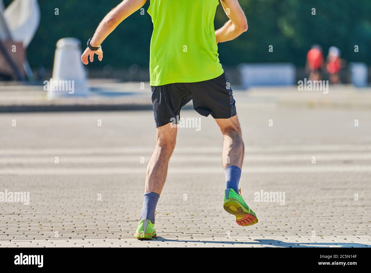 Running man. Athletic man jogging in sportswear on city road. Healthy lifestyle, fitness sport ...