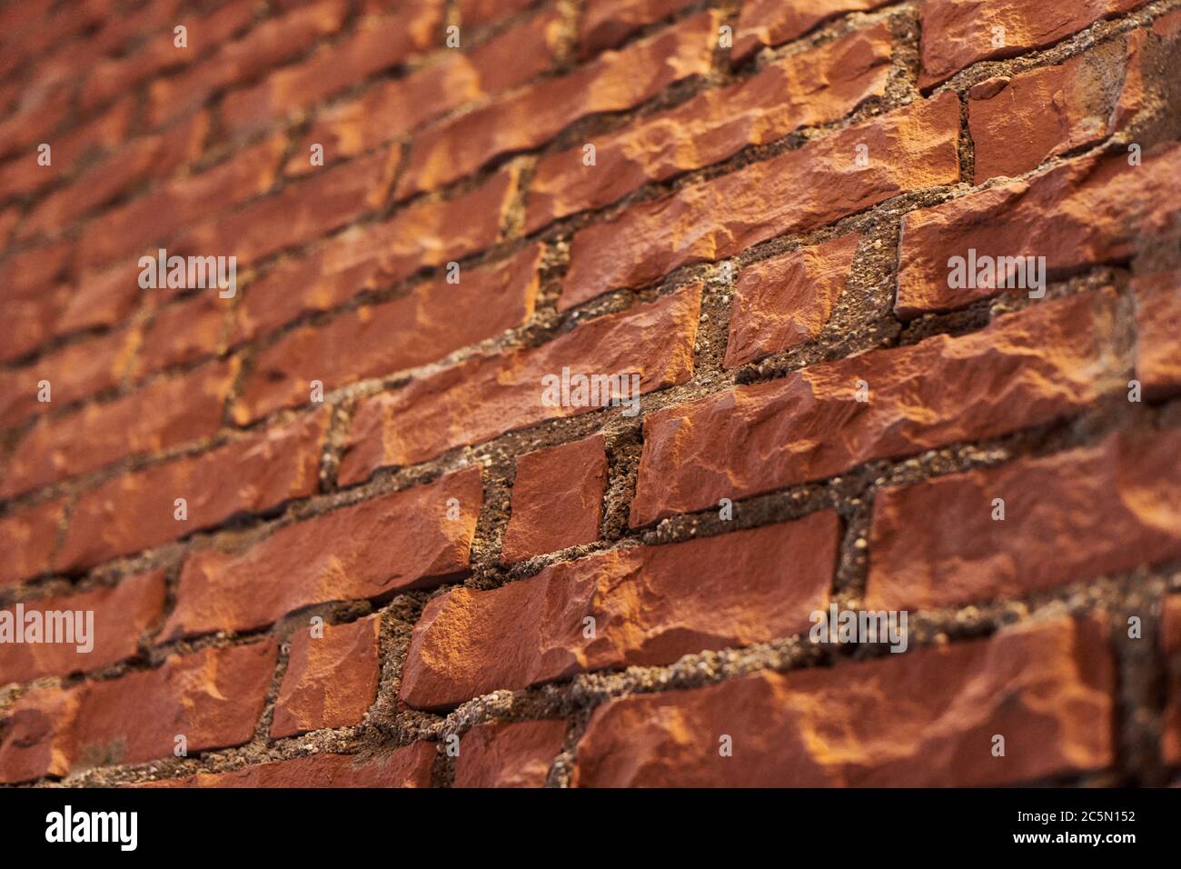 Loft red brick wall, angled view. Polished brick wall in attic interior ...