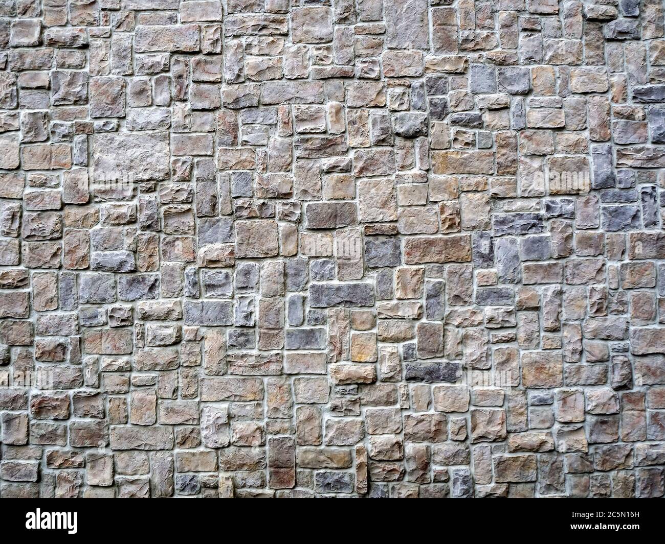 Wall with uneven rough masonry. Full screen closeup photo Stock Photo ...