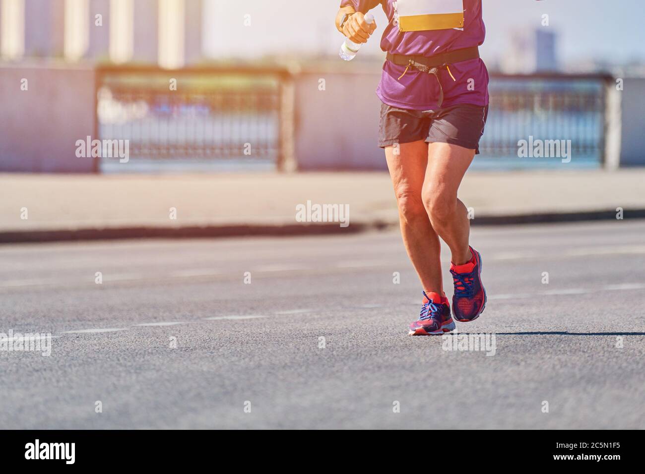 Running woman. Fitness woman jogging in sportswear on city road ...