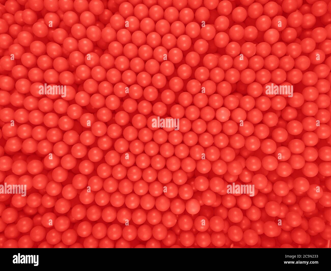 Red dragee balls background for your design Stock Photo - Alamy