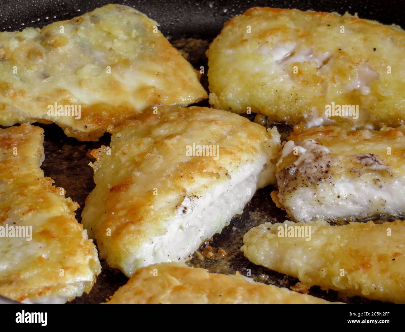 Fish steaks frying in pan hi-res stock photography and images - Alamy