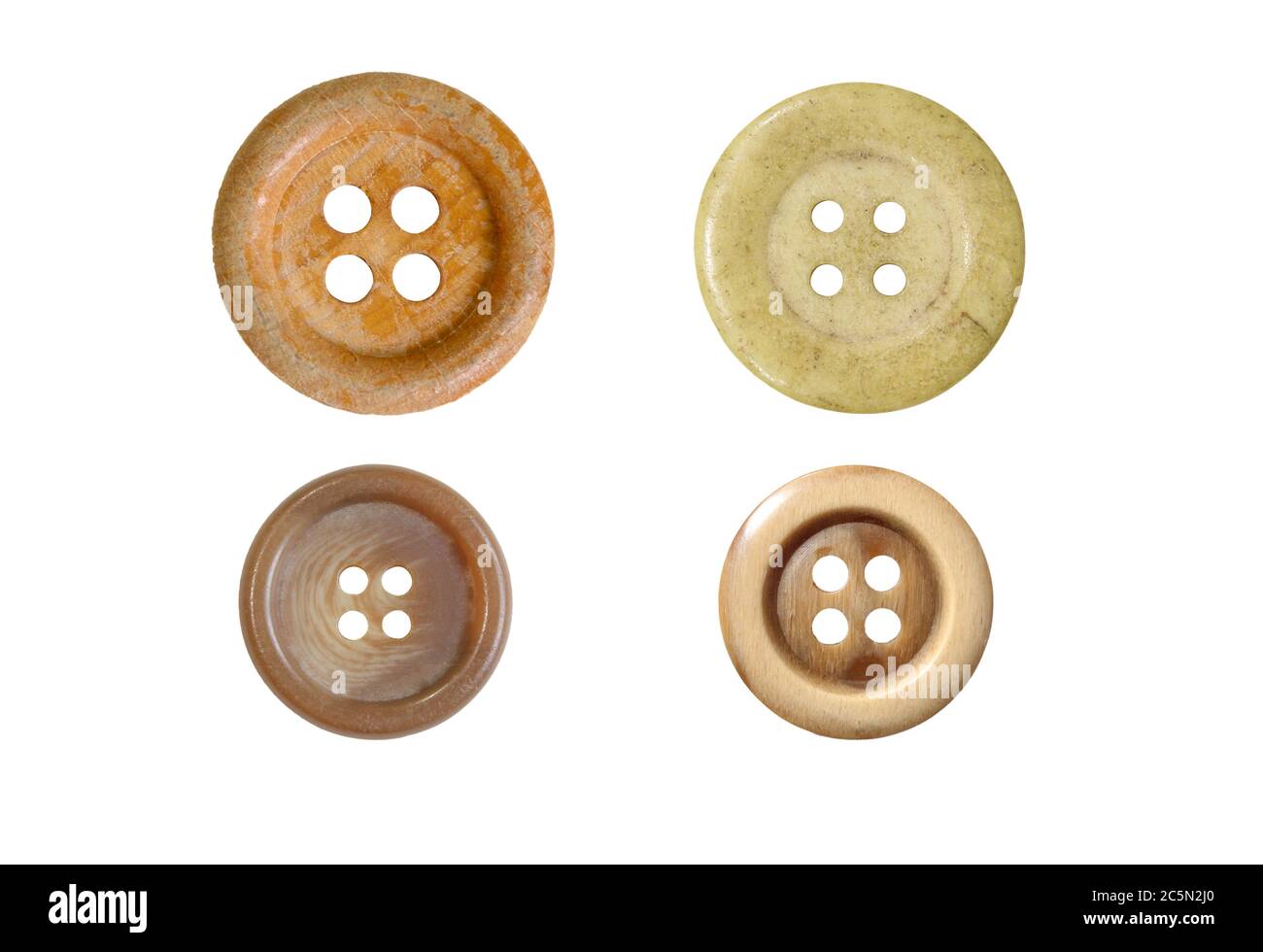 Four different sewing buttons for clothes isolated on white background ...
