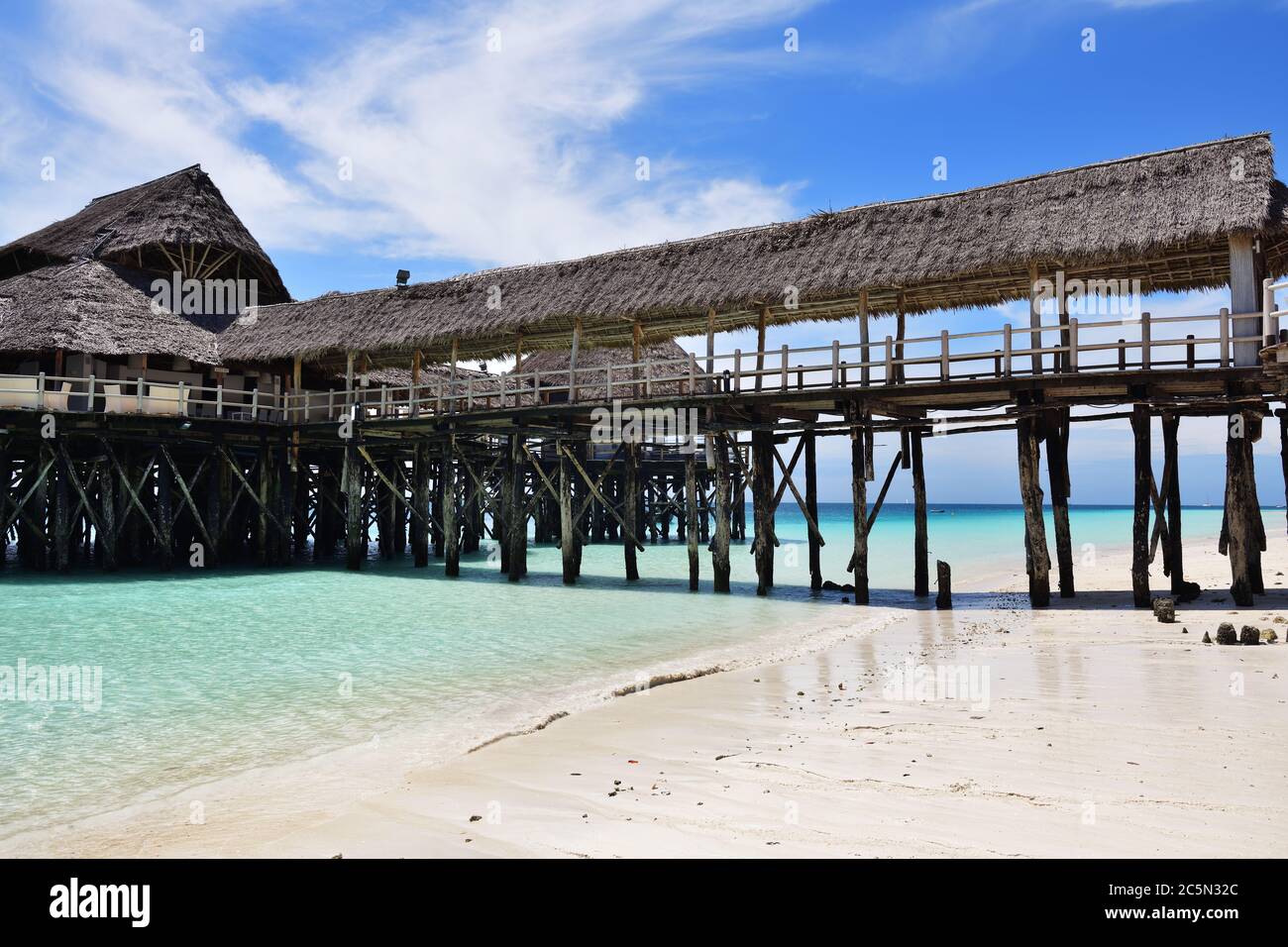 Bridge to the beach cafe in Kendwa resort at low tide. Zanzibar ...