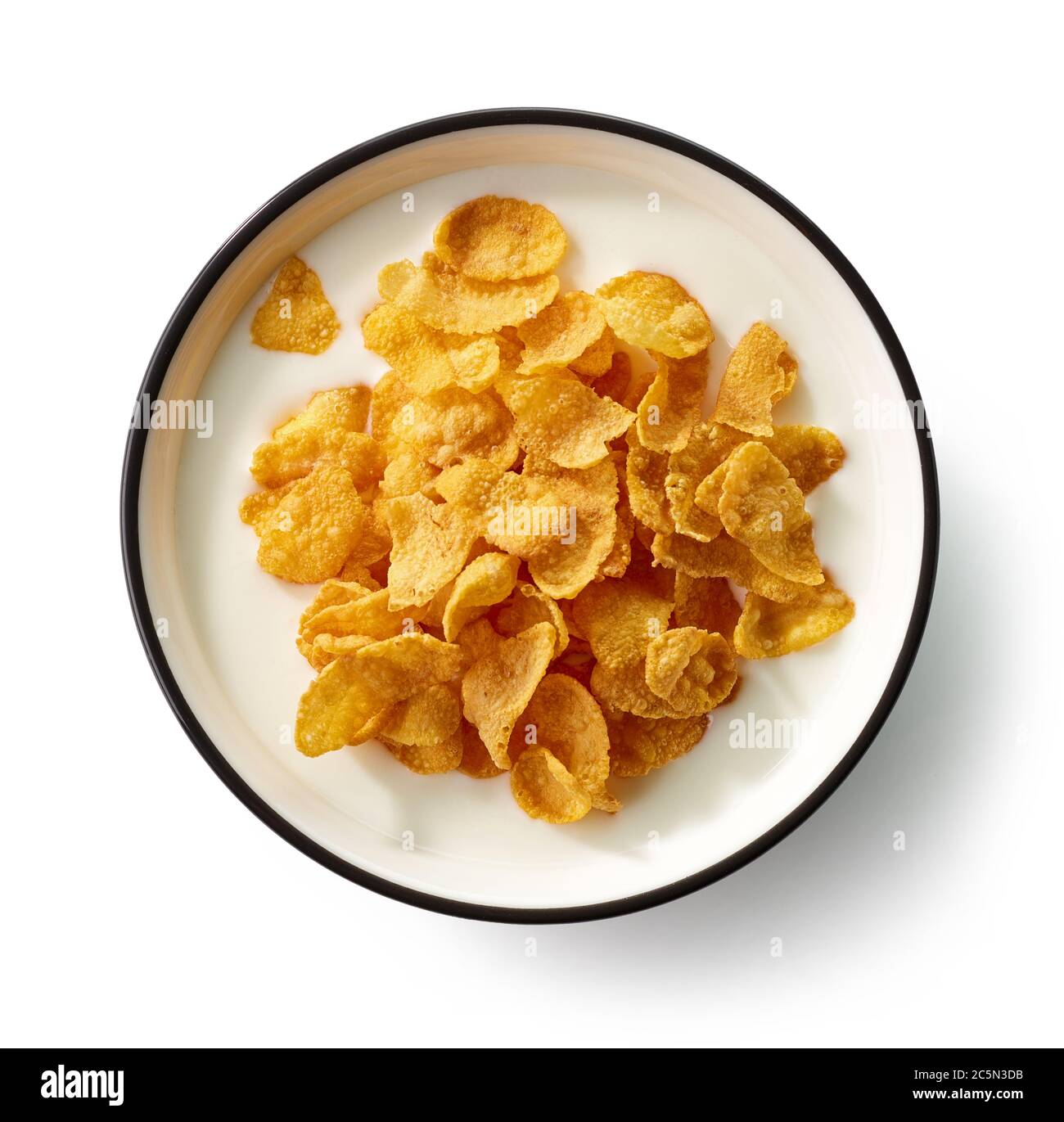 bowl of cornflakes and milk isolated on white background, top view ...