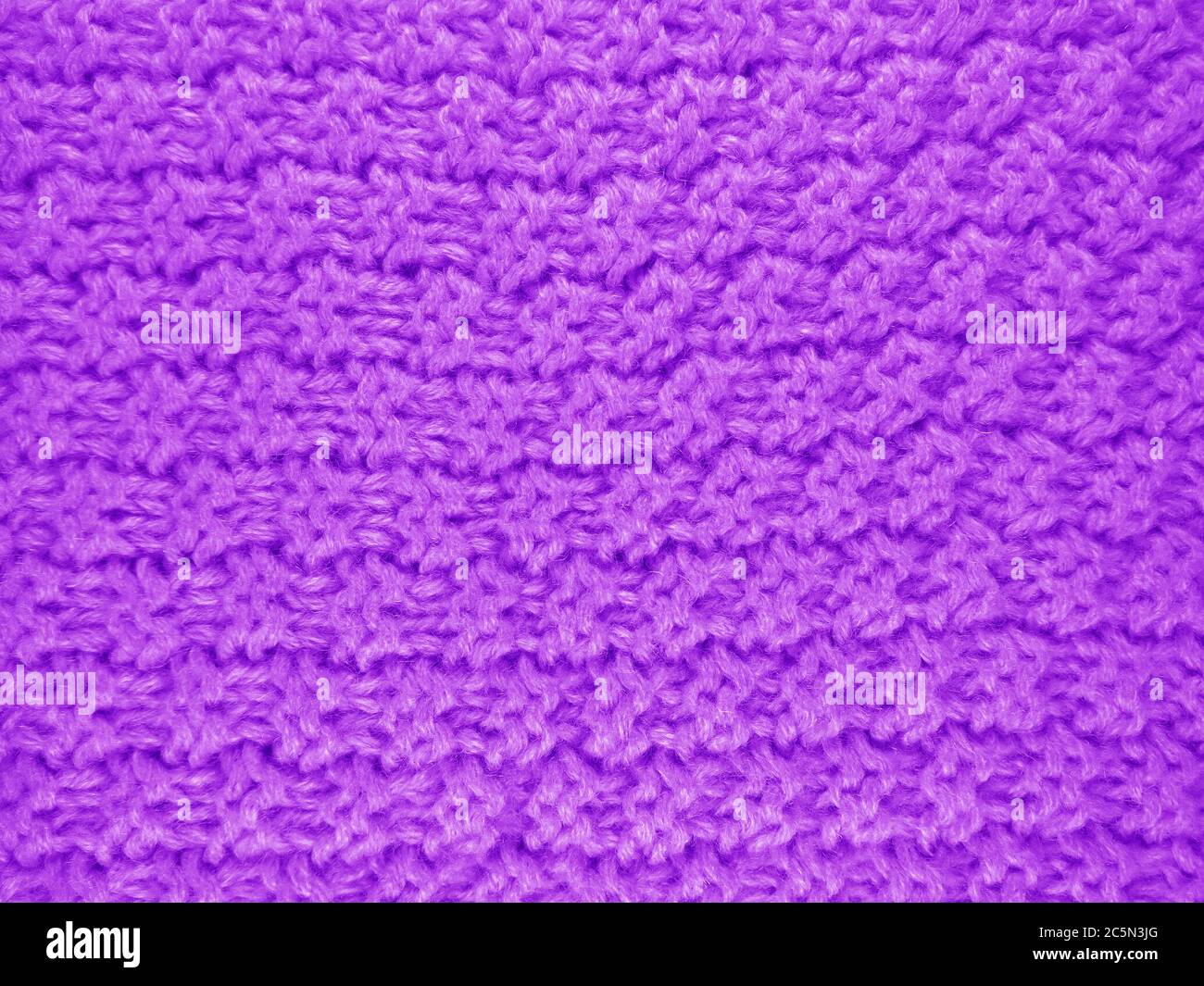 Close up of woolen knitted texture - Violet Stock Photo - Alamy