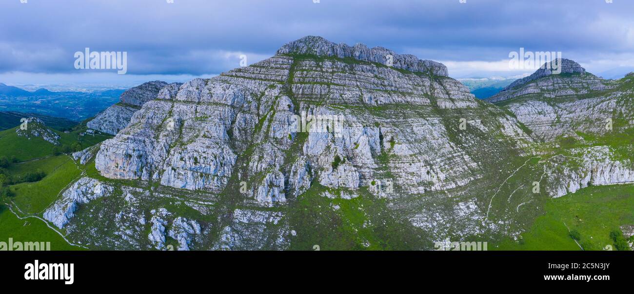 Spring landscape of mountains, meadows of mowing and cabins pasiegas in ...