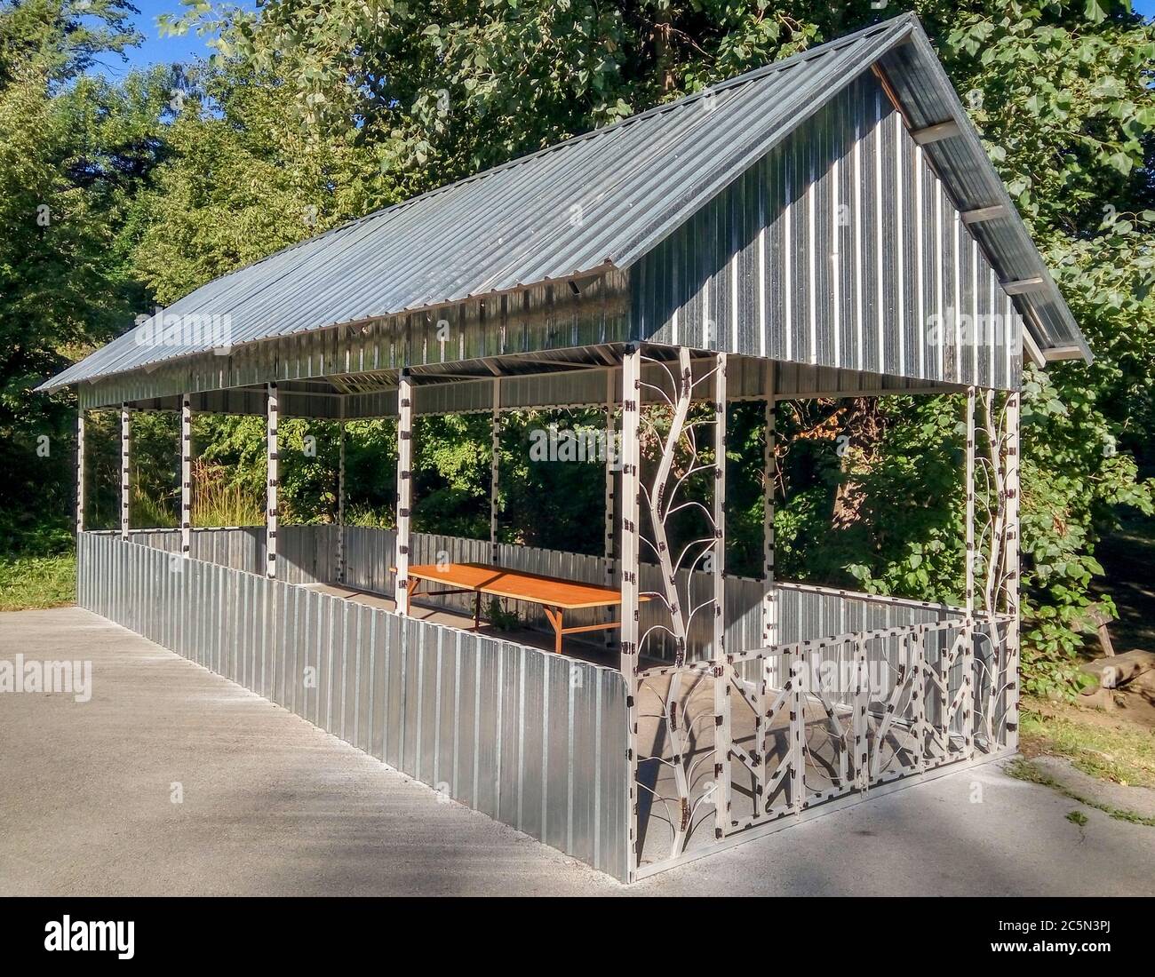 Large metal pavilion in the summer forest Stock Photo - Alamy
