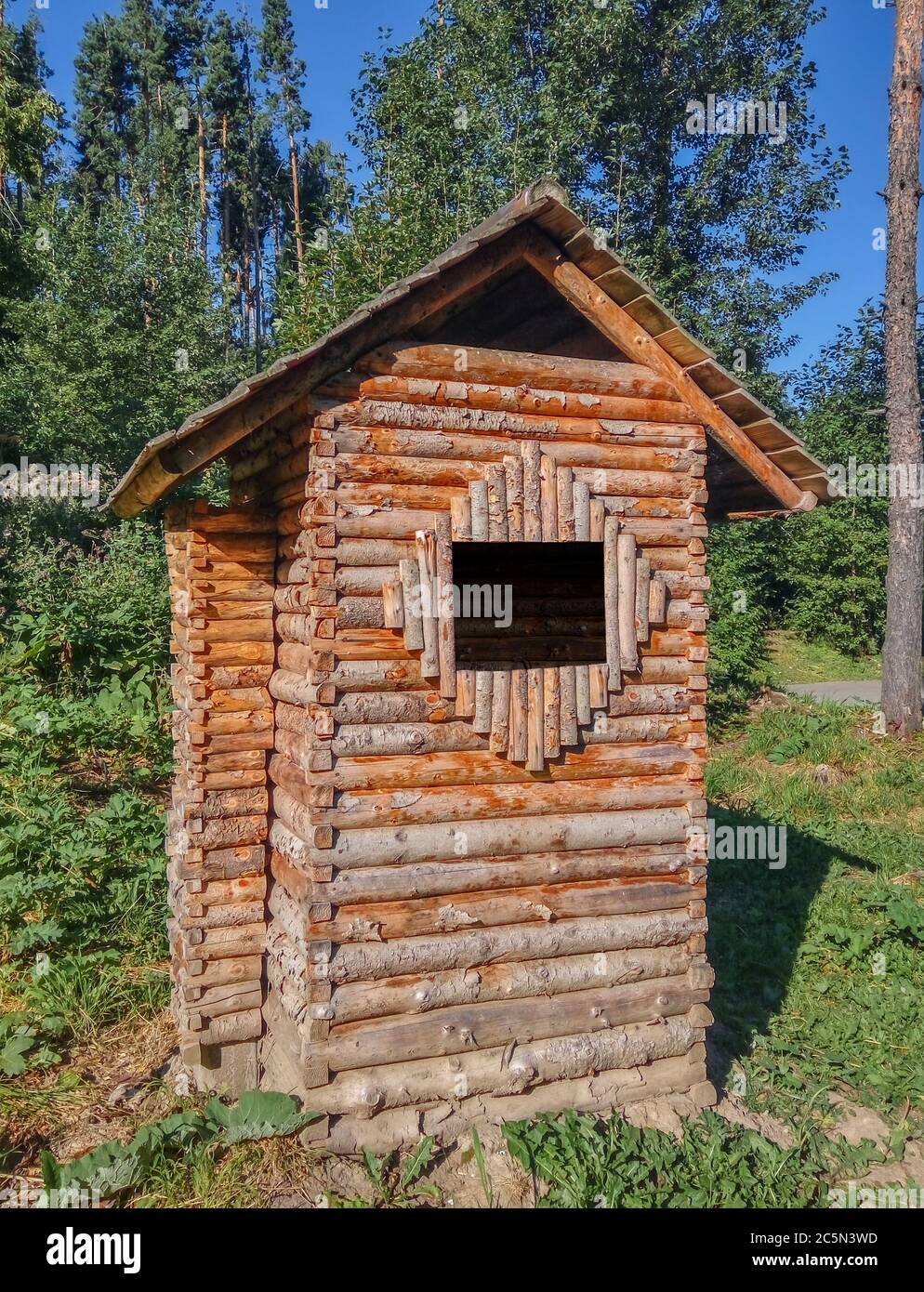 Wooden log cabin in the summer forest Stock Photo - Alamy