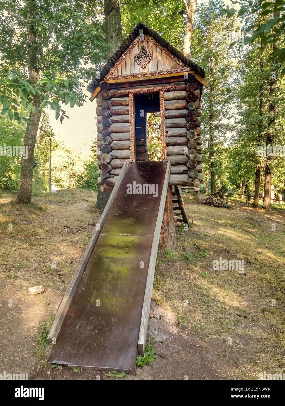Wooden log cabin in the summer forest Stock Photo - Alamy