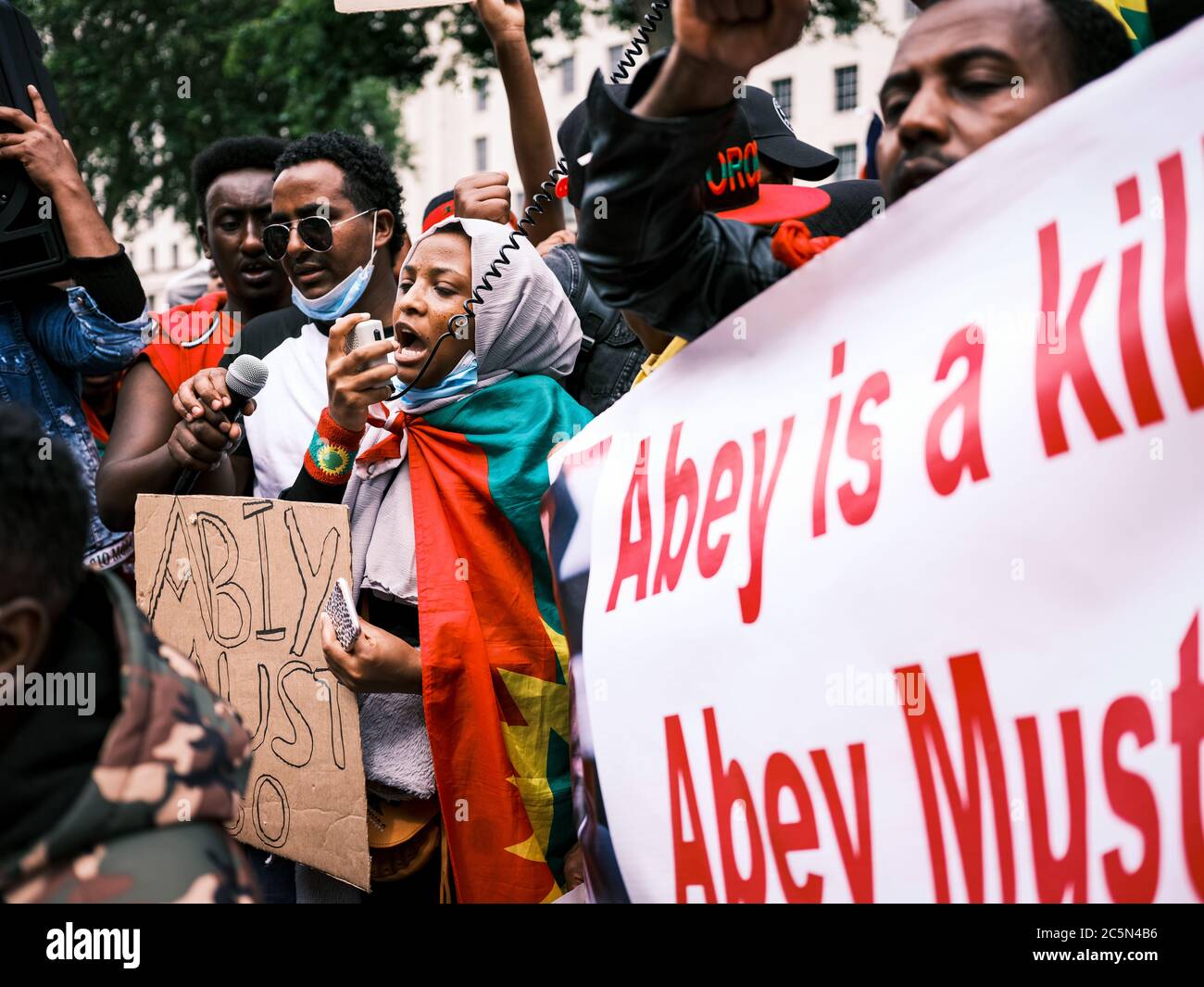 London, UK. 3rd July, 2020. Oromo Protestors march in front of Downing ...