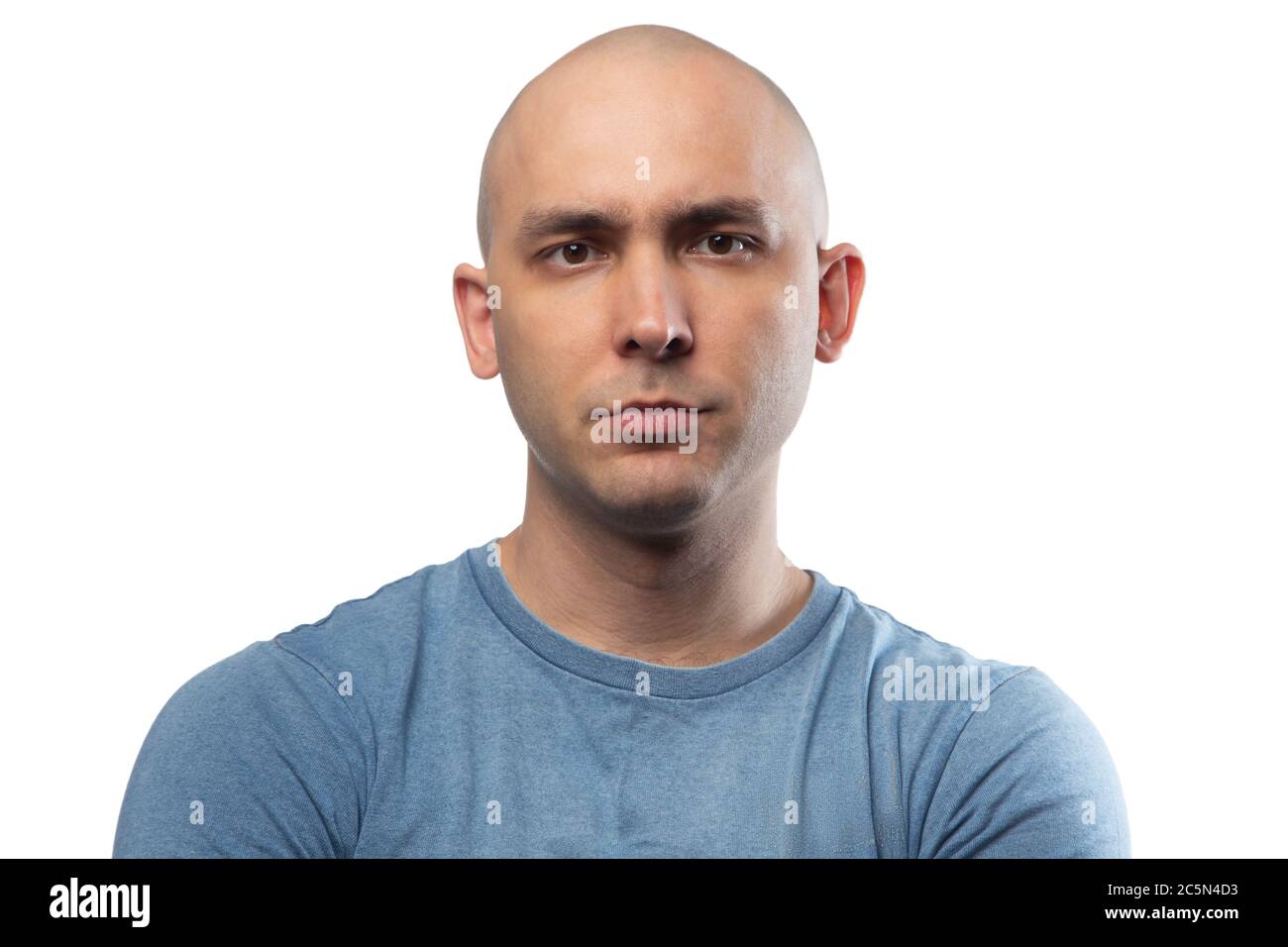 Photo of young bald confused man in blue tee shirt Stock Photo - Alamy