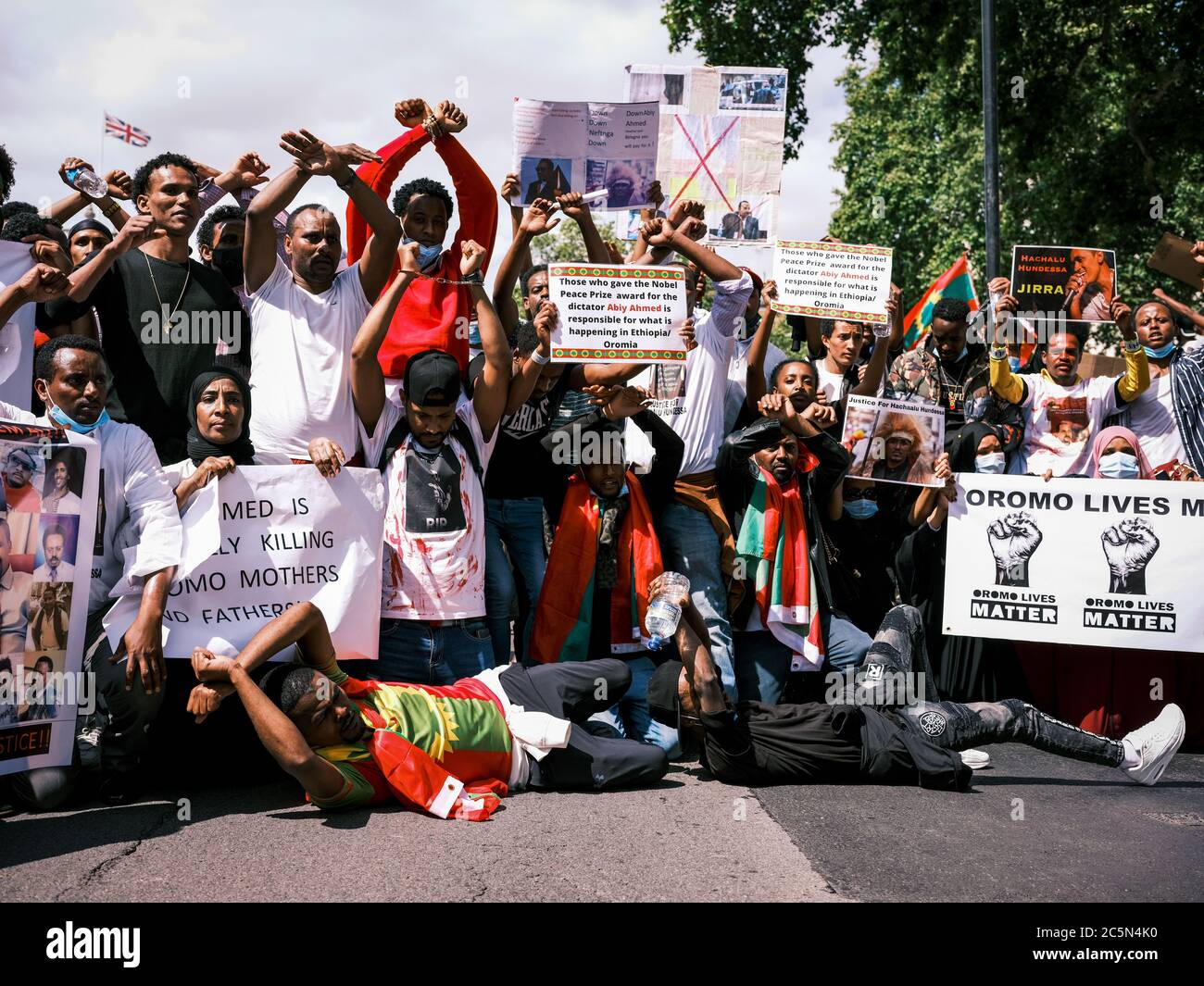 London, UK. 3rd July, 2020. Oromo Protestors march in front of Downing ...
