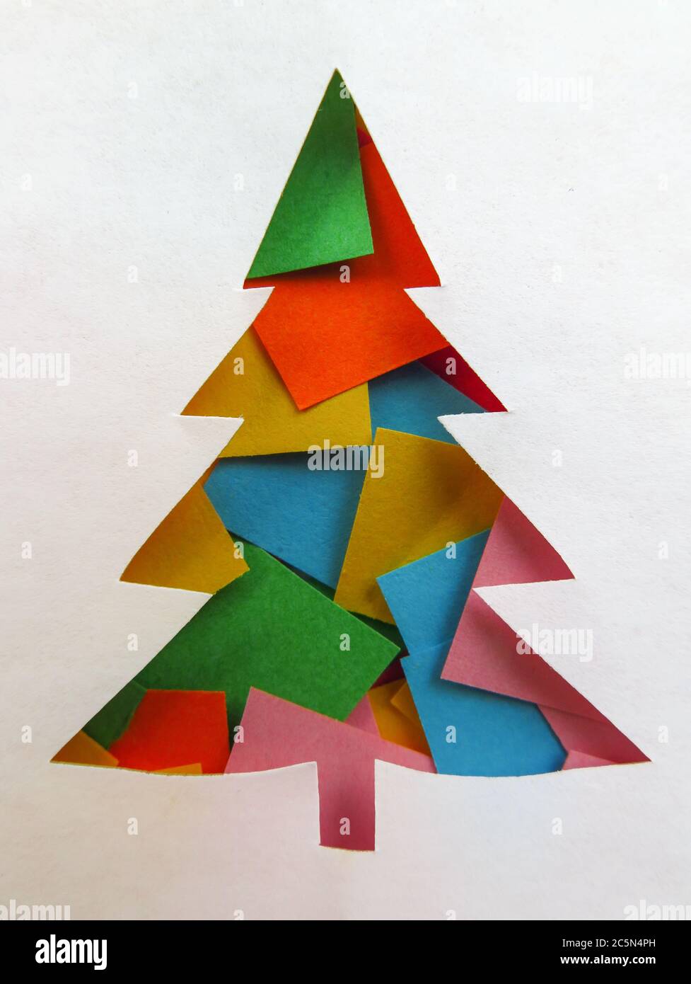 Colorful paper fir tree through white background Stock Photo - Alamy