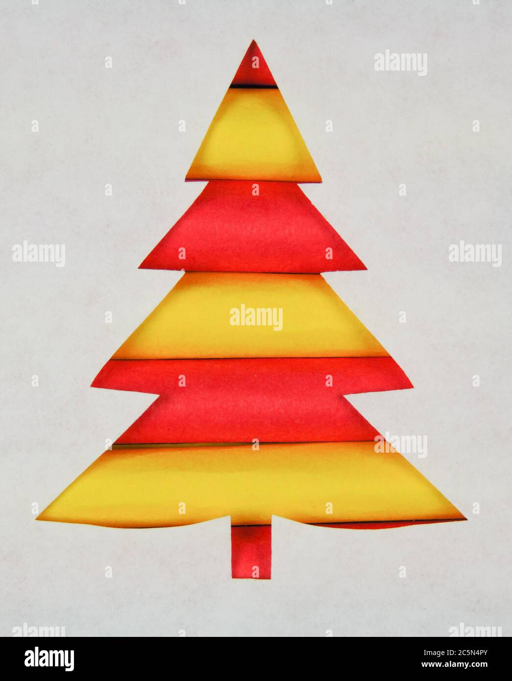 Red-yellow paper fir tree through white background Stock Photo - Alamy