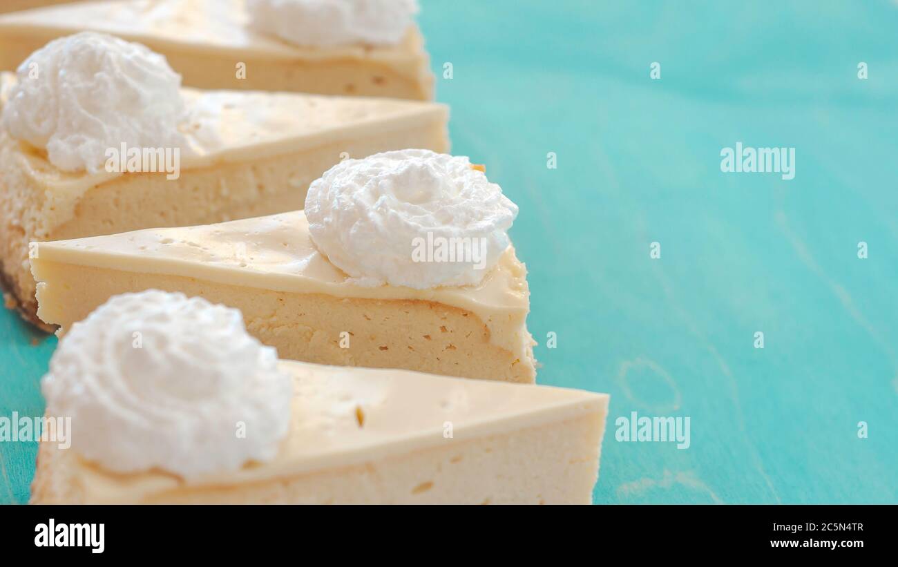 cheesecake pattern, servings of cheesecake on a blue background Stock ...