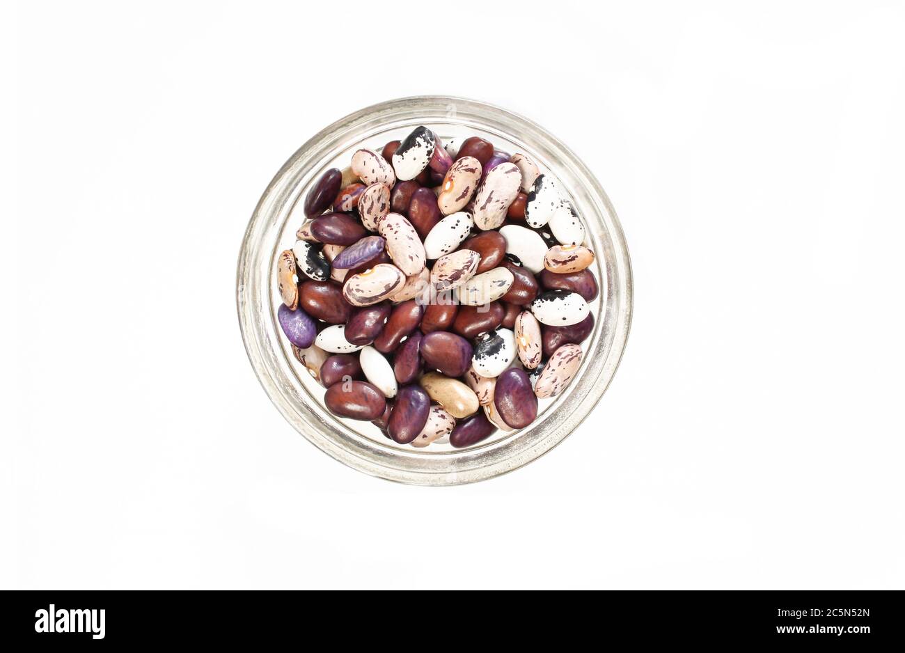 All kinds of kidney beans in a small glass bowl isolated on white ...