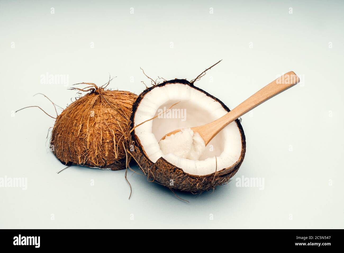 Parts of coconut on a colored background. Close up. Fresh ripe coconut ...