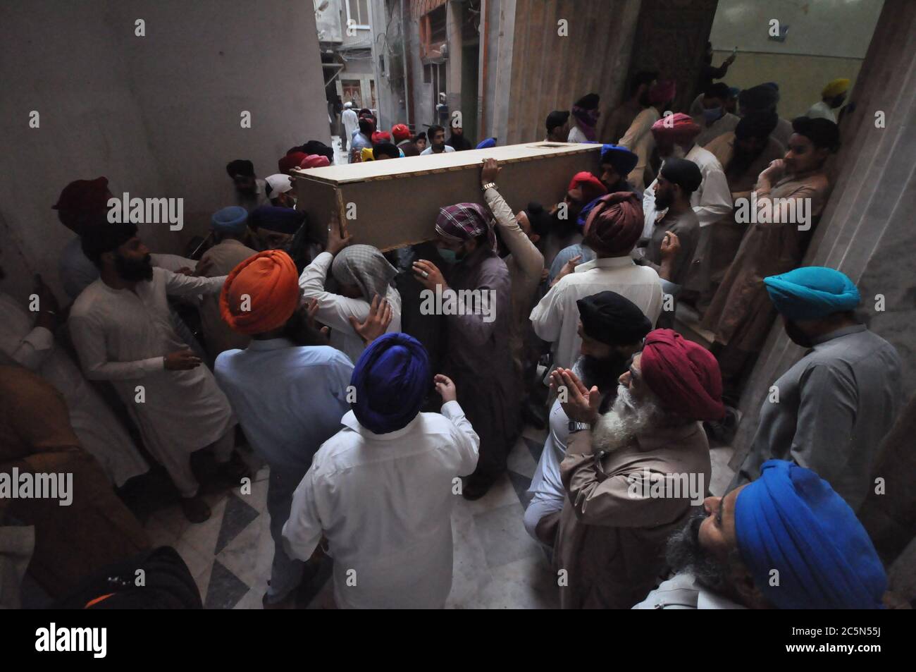 (7/4/2020) Minority Sikh gather beside the dead bodies of Sikhs in ...