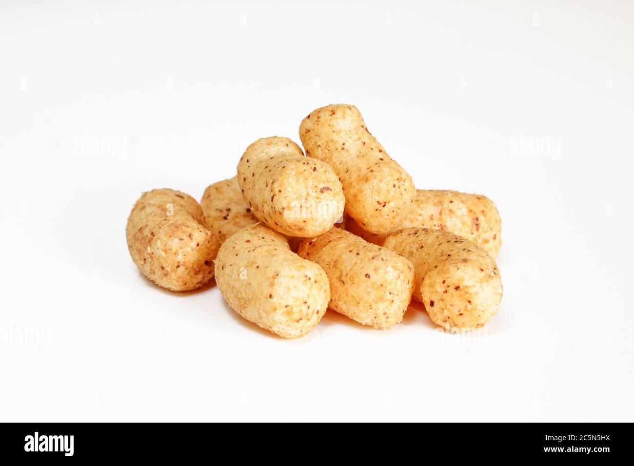 Peanut flips isolated on white background. Pile of snack food close-up ...