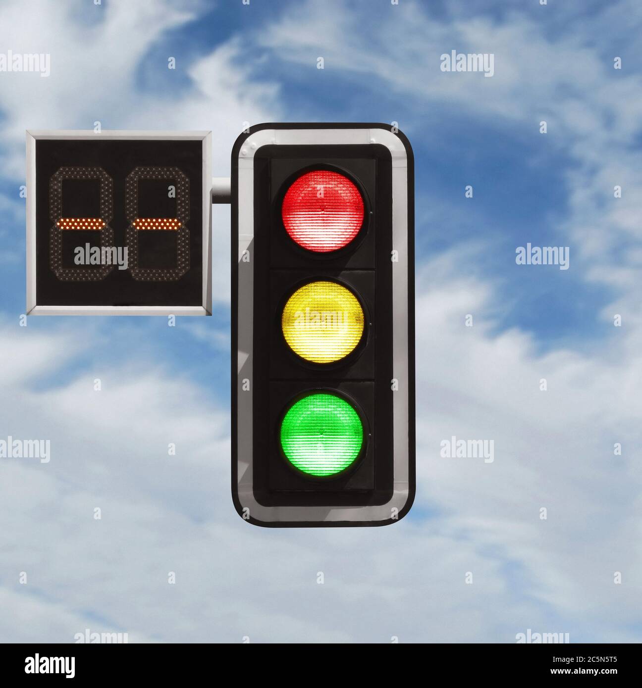Traffic light with timer against blue sky background with Clipping Path ...