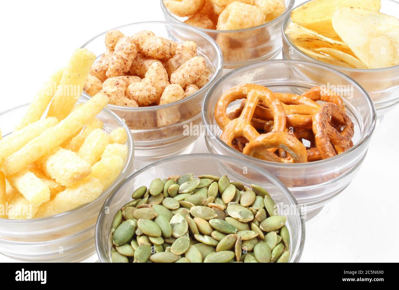 Assorted salty snacks and crisps. Closeup of junk food for party Stock ...