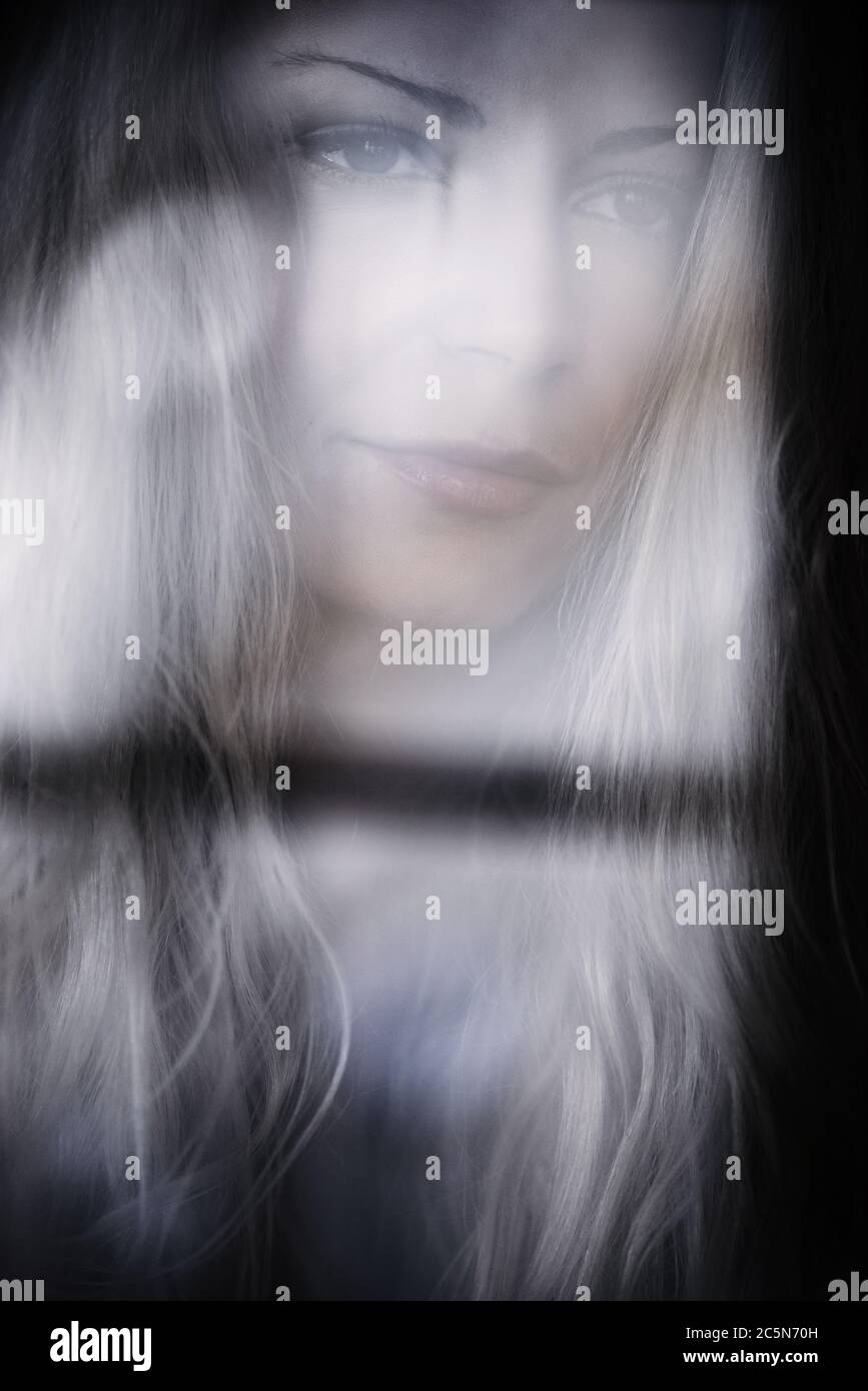 Woman behind glass hi-res stock photography and images - Alamy